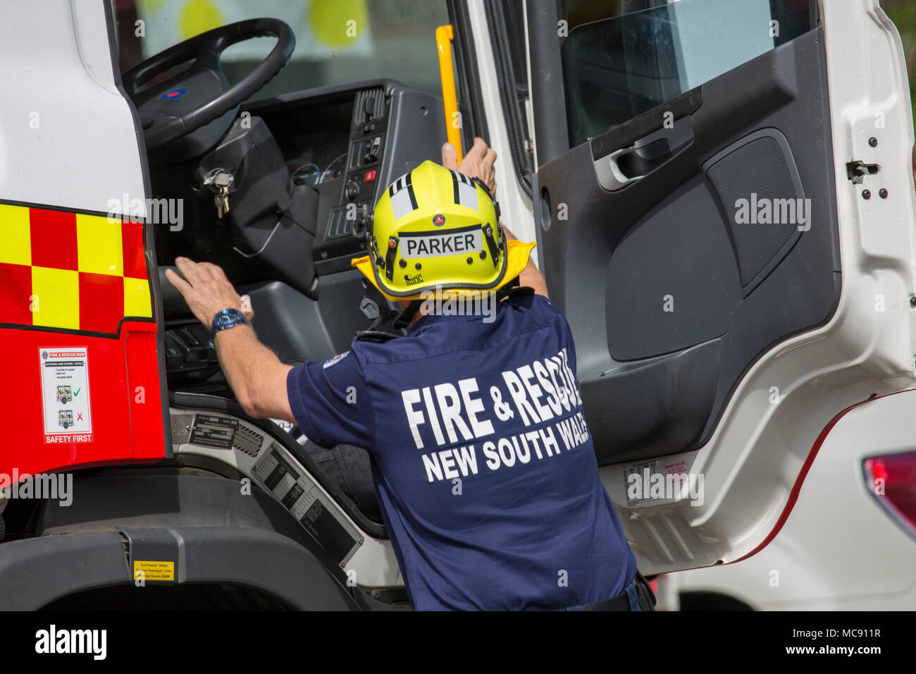 Australian fireman climbing into his fire engine truck,Sydney Stock ...