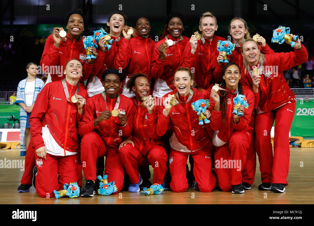 The England women's netball team celebrate with their gold medals at ...