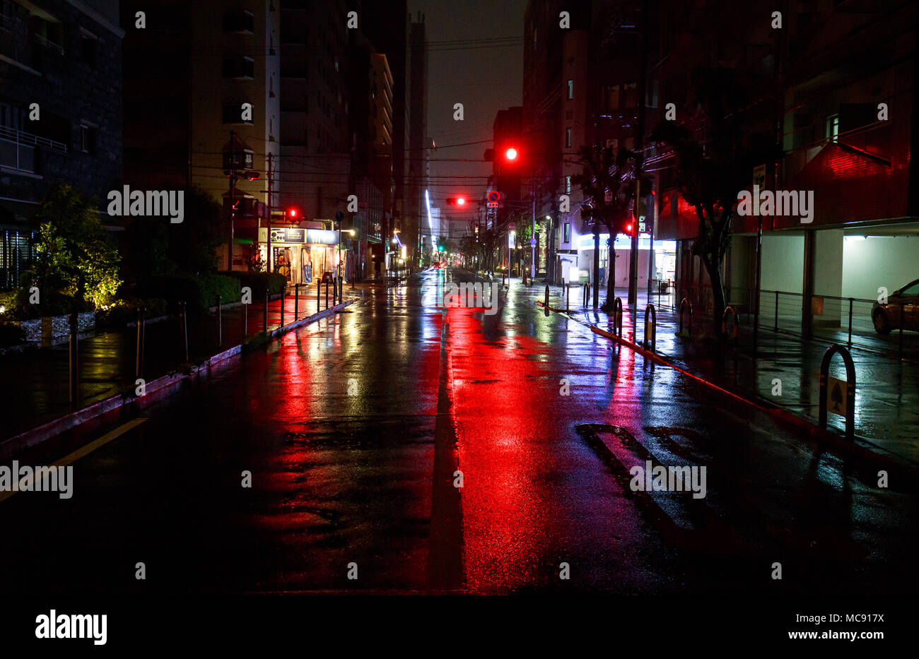 Osaka, Japan - April 14, 2018: Red lights reflecting on an empty ...