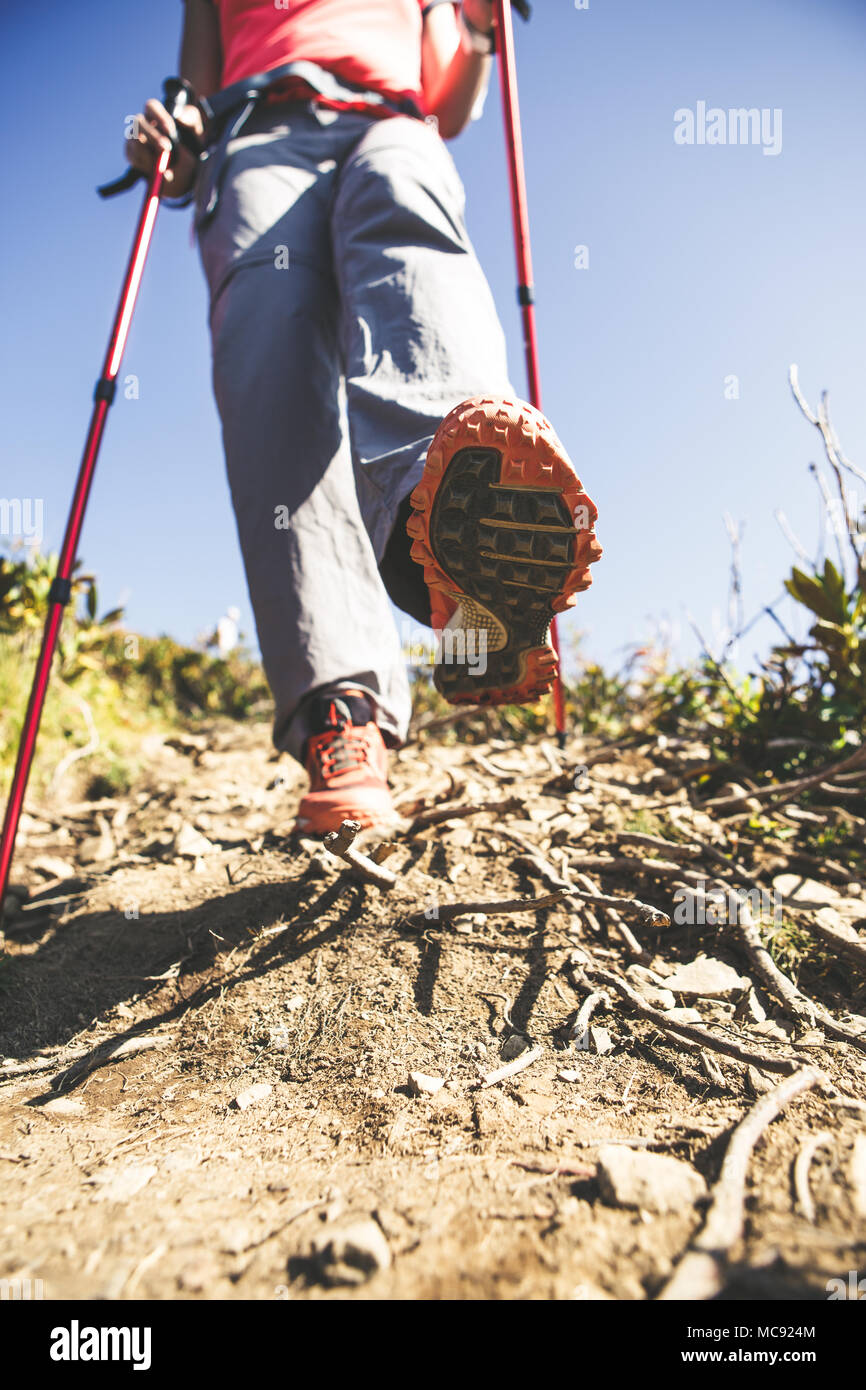 Photo of tourist human with sticks for sport walking Stock Photo - Alamy