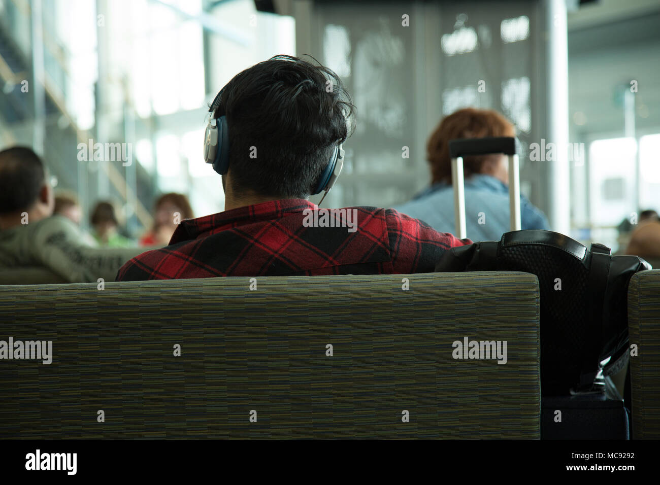 Back view young male headphone closeup Stock Photo - Alamy