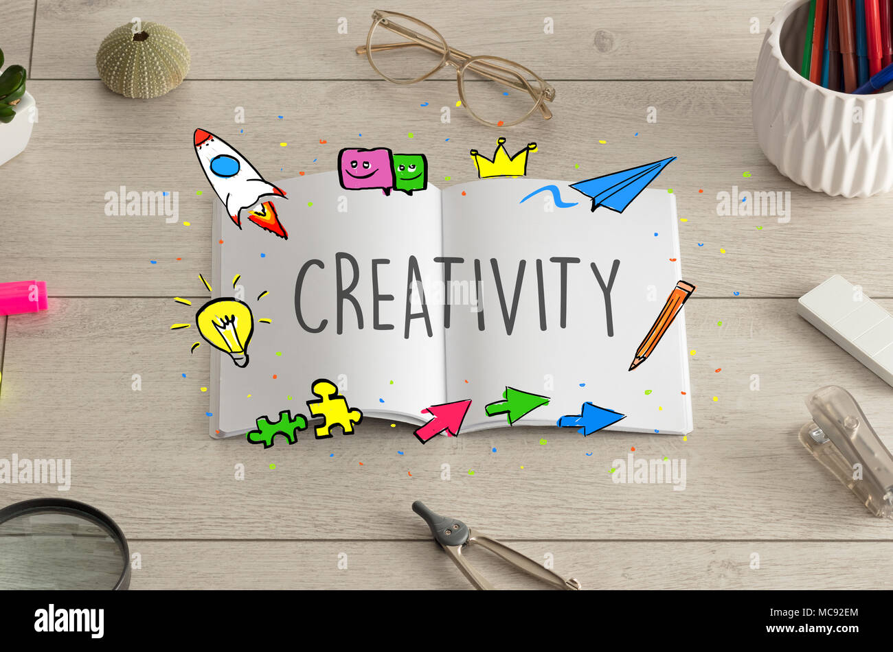 Open notebook on the floor with instruments on the floor and creativity ...