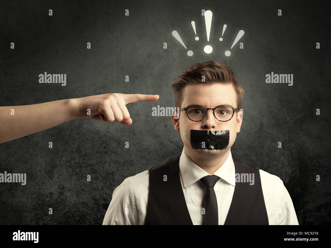 Caucasian hand pointing at employee in business suit, with drawn ...