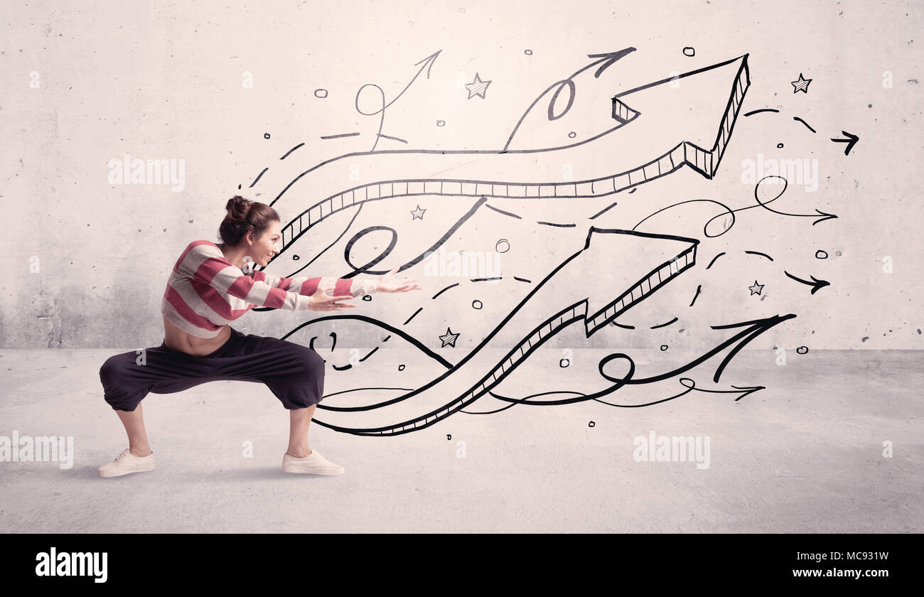 A beautiful young hip hop dancer dancing contemporary street dance in ...