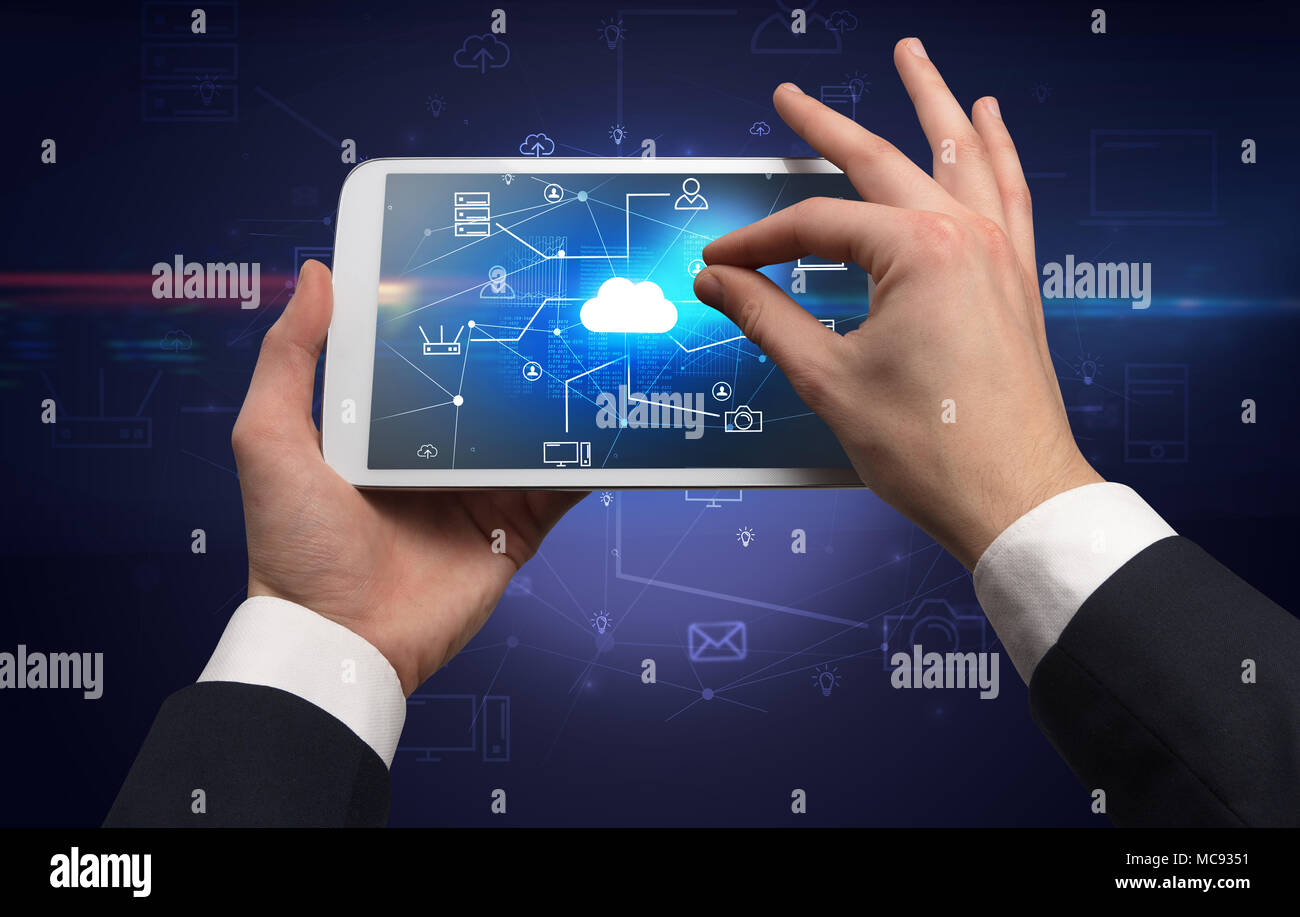 First person view of a hand using tablet with cloud office concept ...