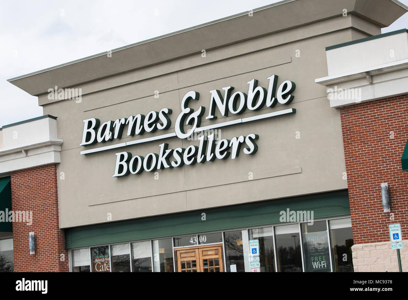 A logo sign outside of a Barnes and Noble Booksellers retail store in ...