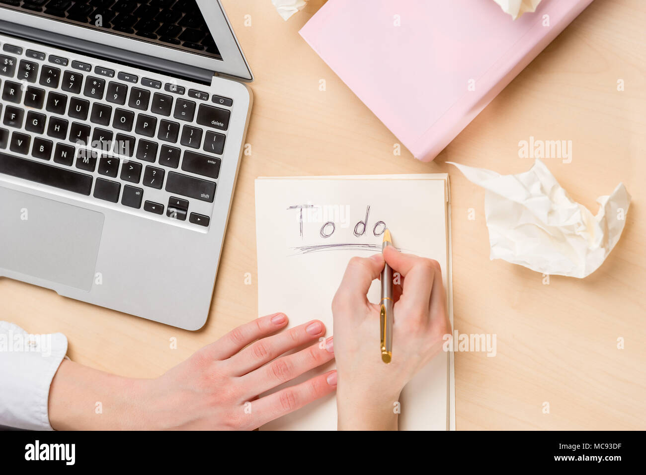 top view of the desktop, notepad for notes and female hands Stock Photo ...