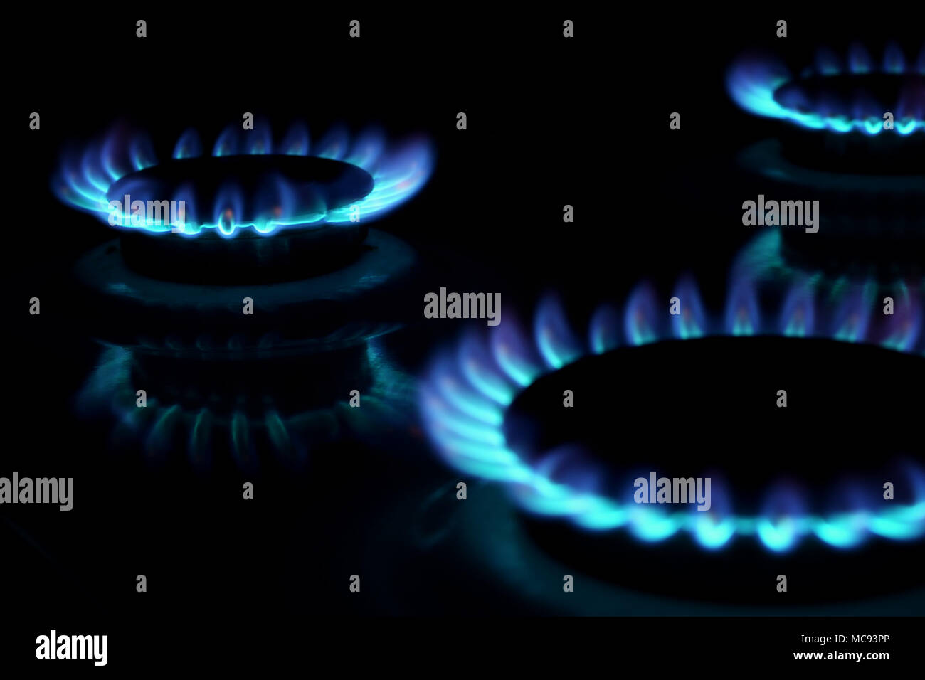 Gas burning in the burner over black background Stock Photo - Alamy