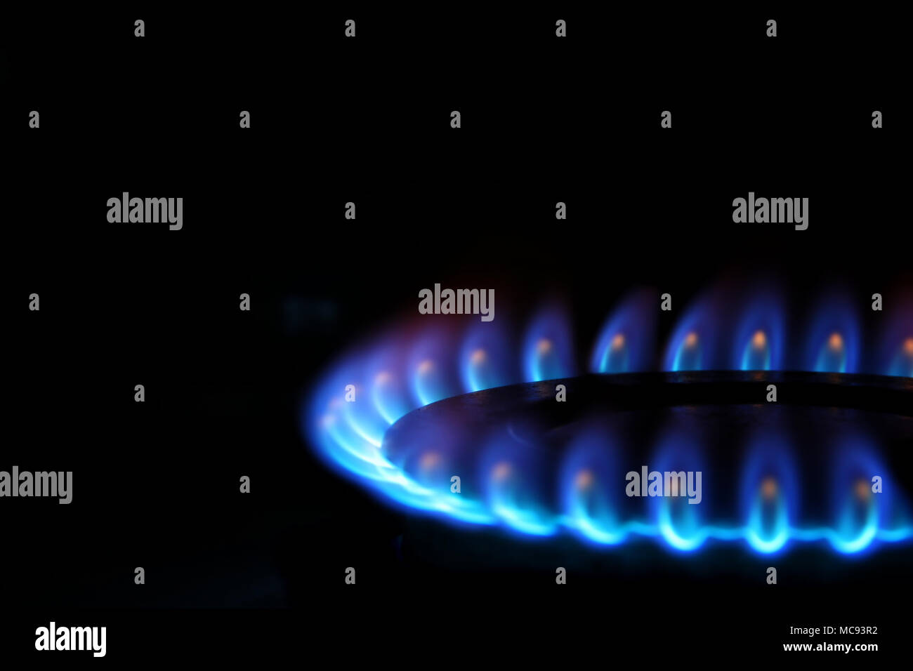 Gas burning in the burner over black background Stock Photo - Alamy