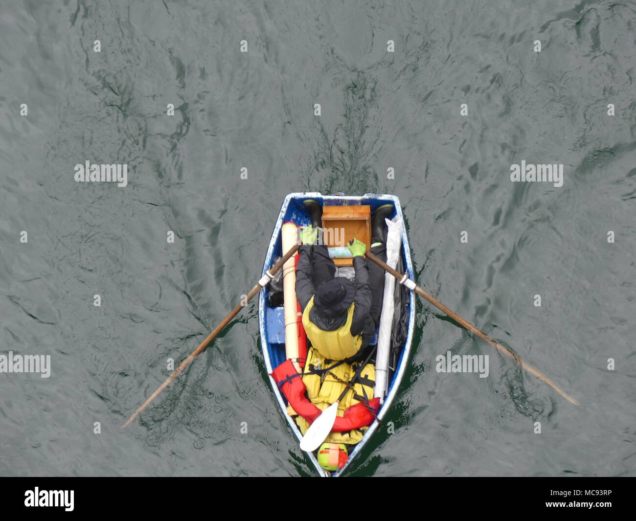 Aerial shot male in the middle of ocean rowing Stock Photo - Alamy