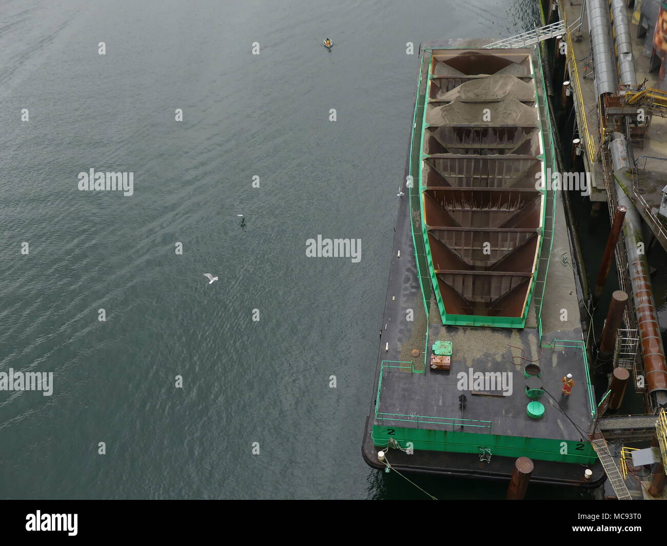 Unloading cement dry ship high angle Stock Photo - Alamy