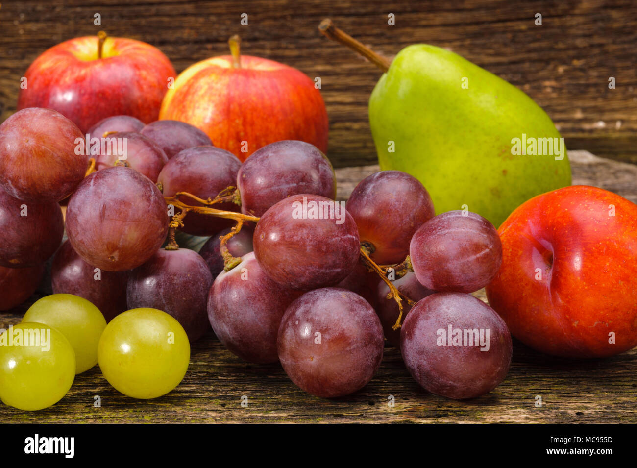 arrangement of fresh fruits from market over wooden planks Stock Photo ...