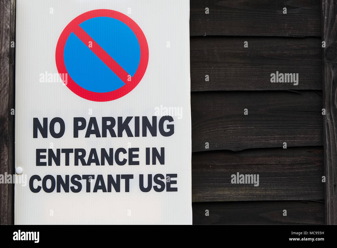 No parking Entrance in constant use 24 hour access required sign. Thank ...