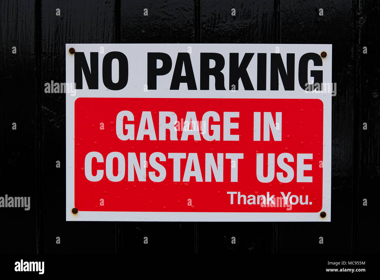 No parking Garage in constant use sign. Thank you. Red, white and black ...