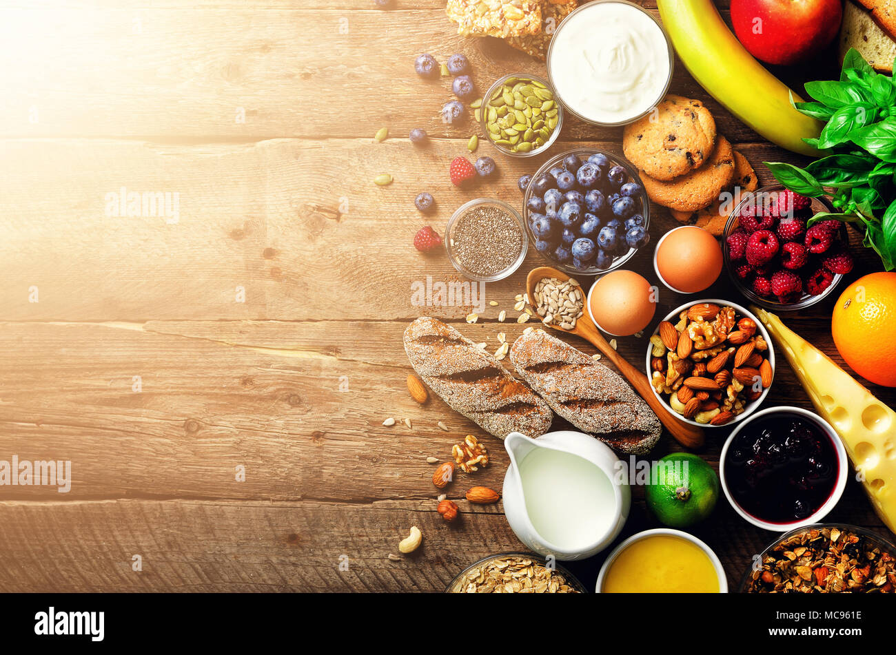 Healthy breakfast ingredients, food frame. Granola, egg, nuts, fruits ...