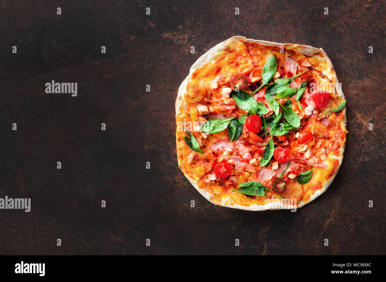 Homemade pizza. Top view with copy space on dark stone table Stock ...