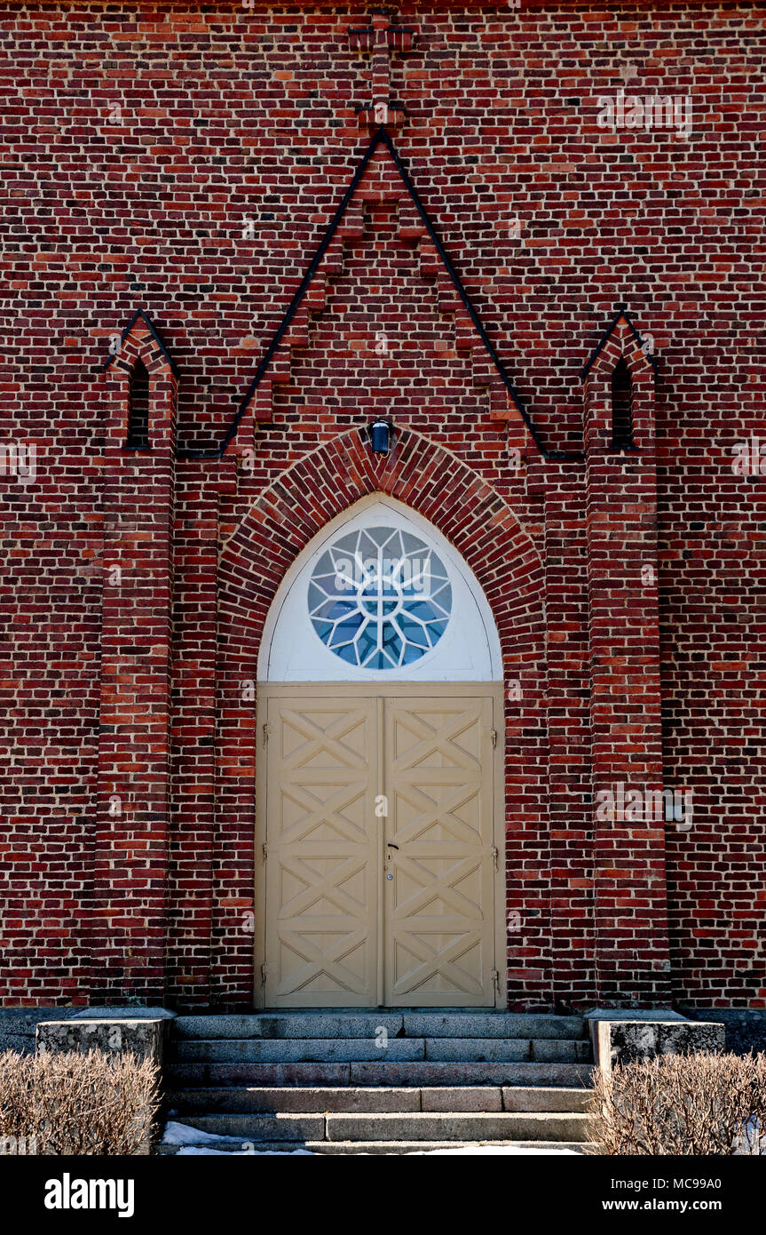 A church door with round window Stock Photo - Alamy