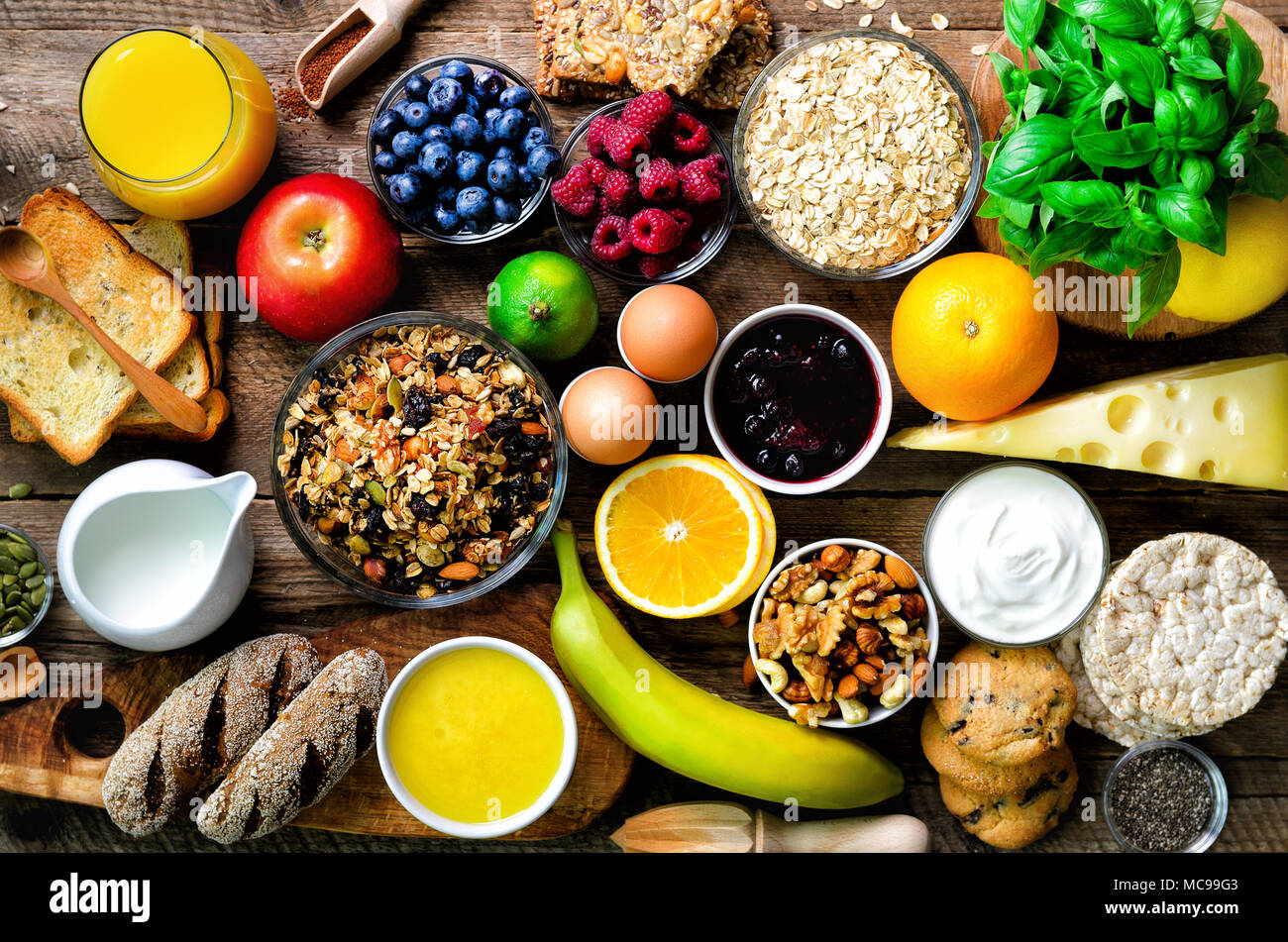 Healthy breakfast ingredients, food frame. Granola, egg, nuts, fruits ...
