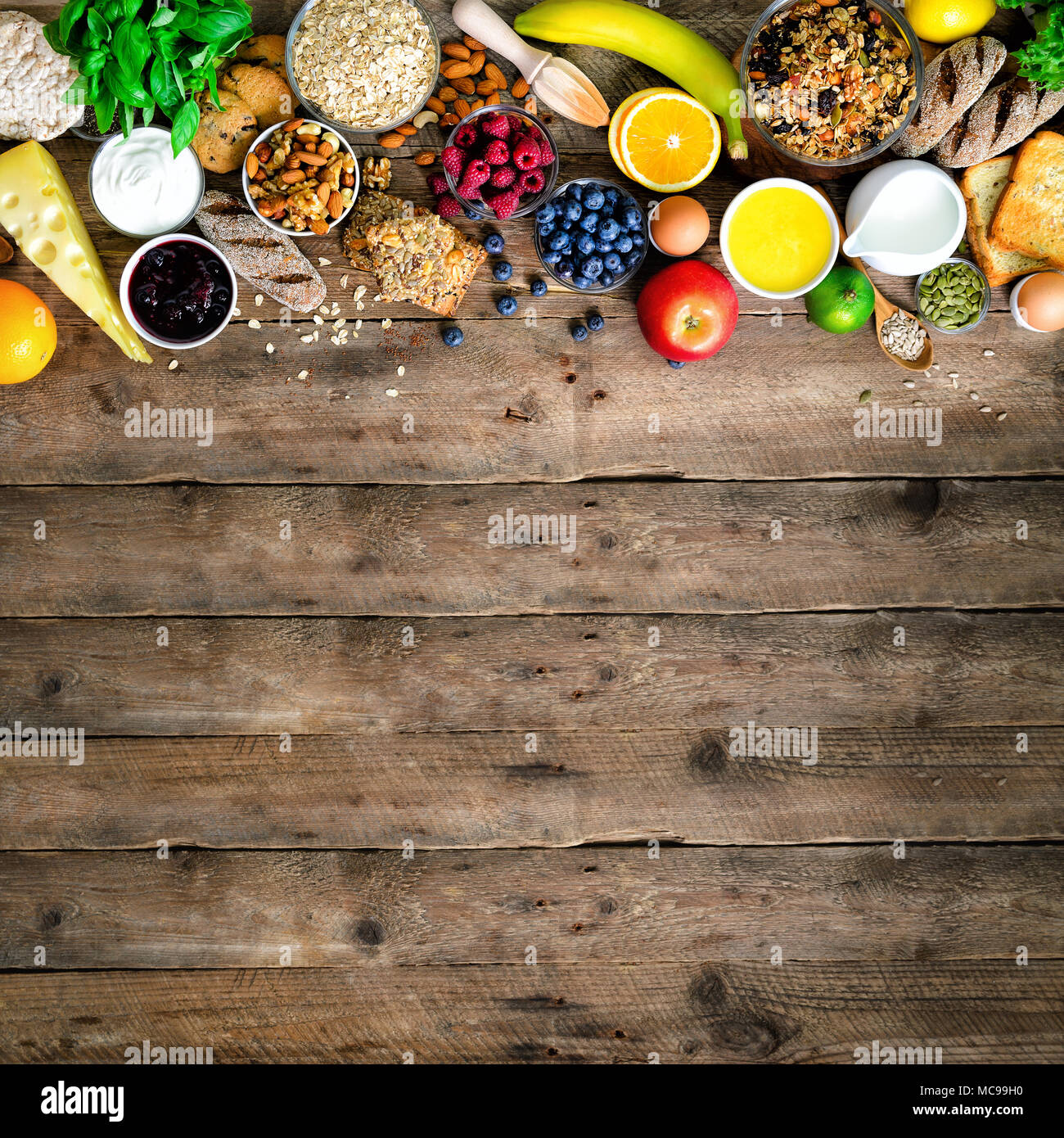 Healthy breakfast ingredients, food frame. Granola, egg, nuts, fruits ...