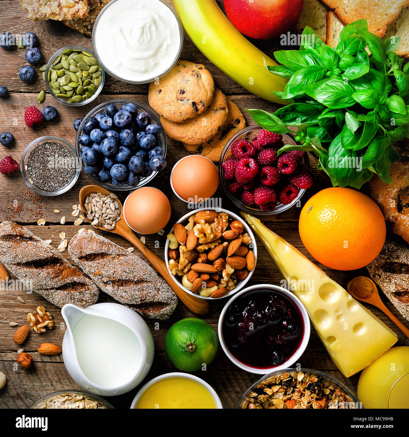 Healthy breakfast ingredients, food frame. Granola, egg, nuts, fruits ...