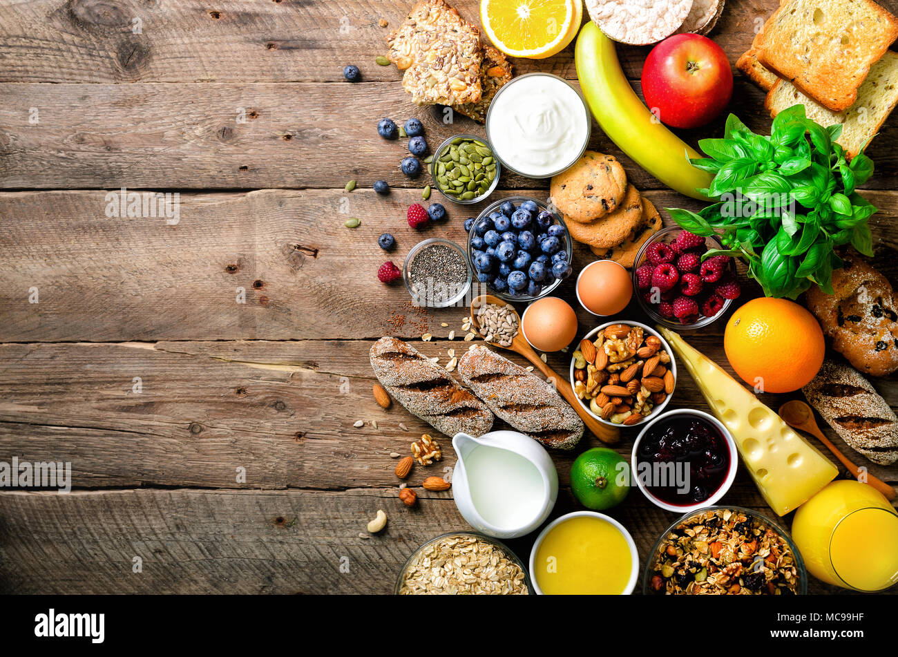 Healthy breakfast ingredients, food frame. Granola, egg, nuts, fruits ...