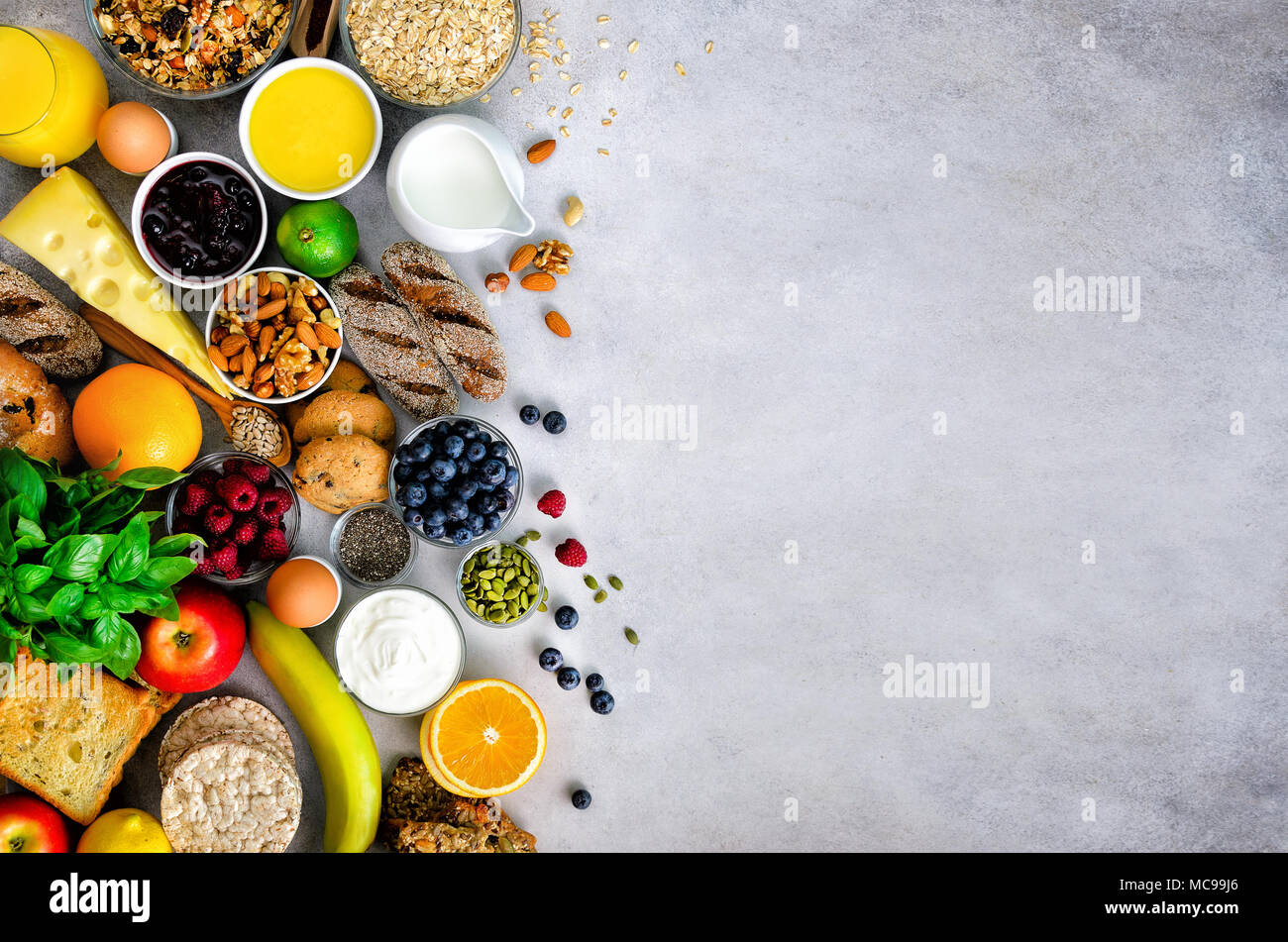 Healthy breakfast ingredients, food frame. Granola, egg, nuts, fruits ...