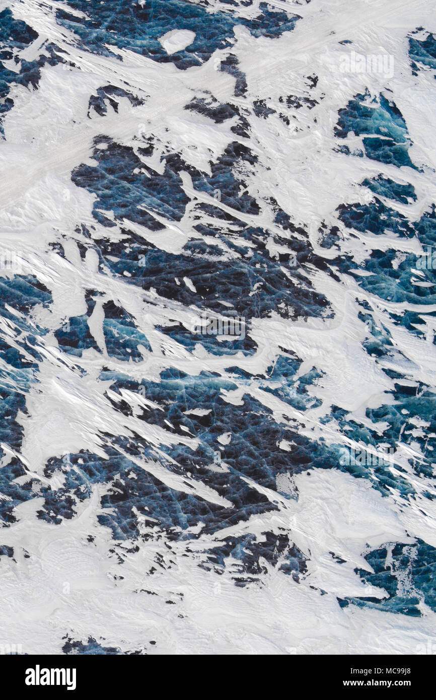 Aerial view of frozen lake in the Arctic showing patterns of the ice ...