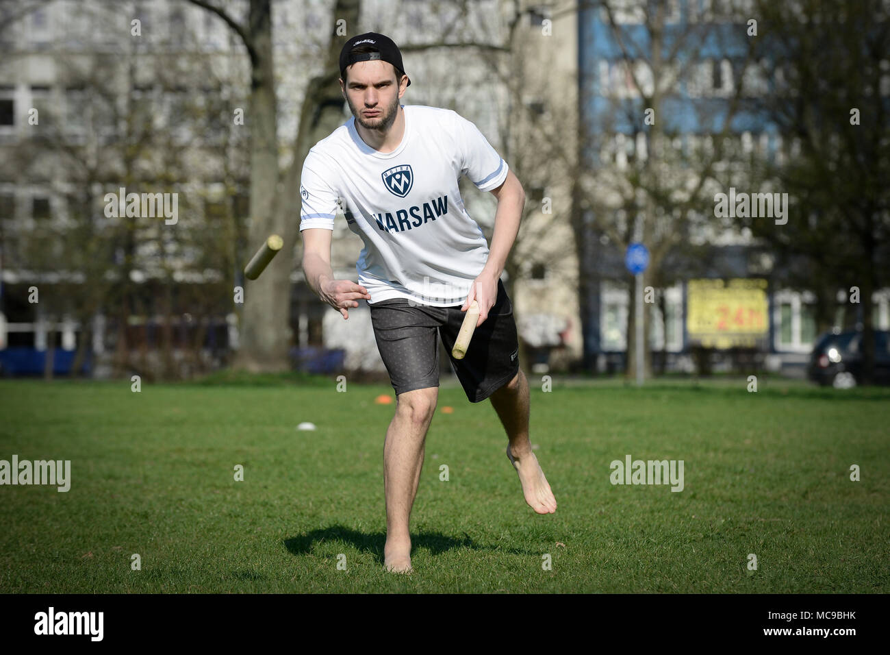 People are seen playing the Kubb lawn game in Mokotowski Park in Warsaw ...