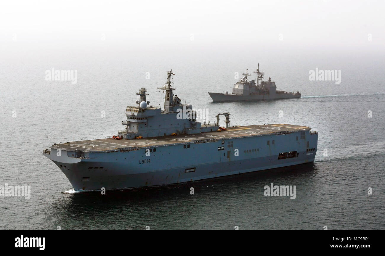 The French amphibious assault ship LHD Tonnerre (L9014), front, and the ...