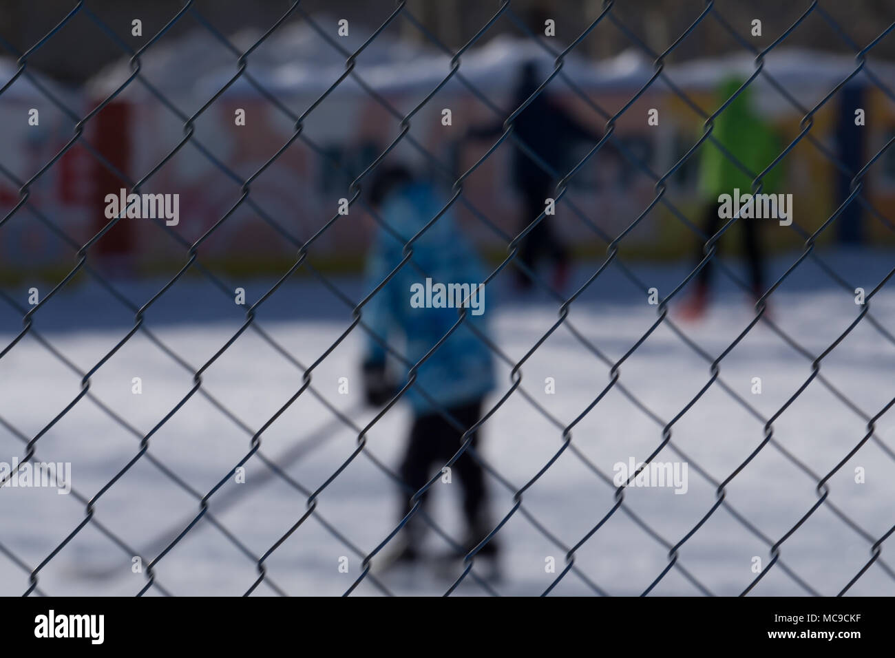 blurred hand behind steel cage Stock Photo - Alamy