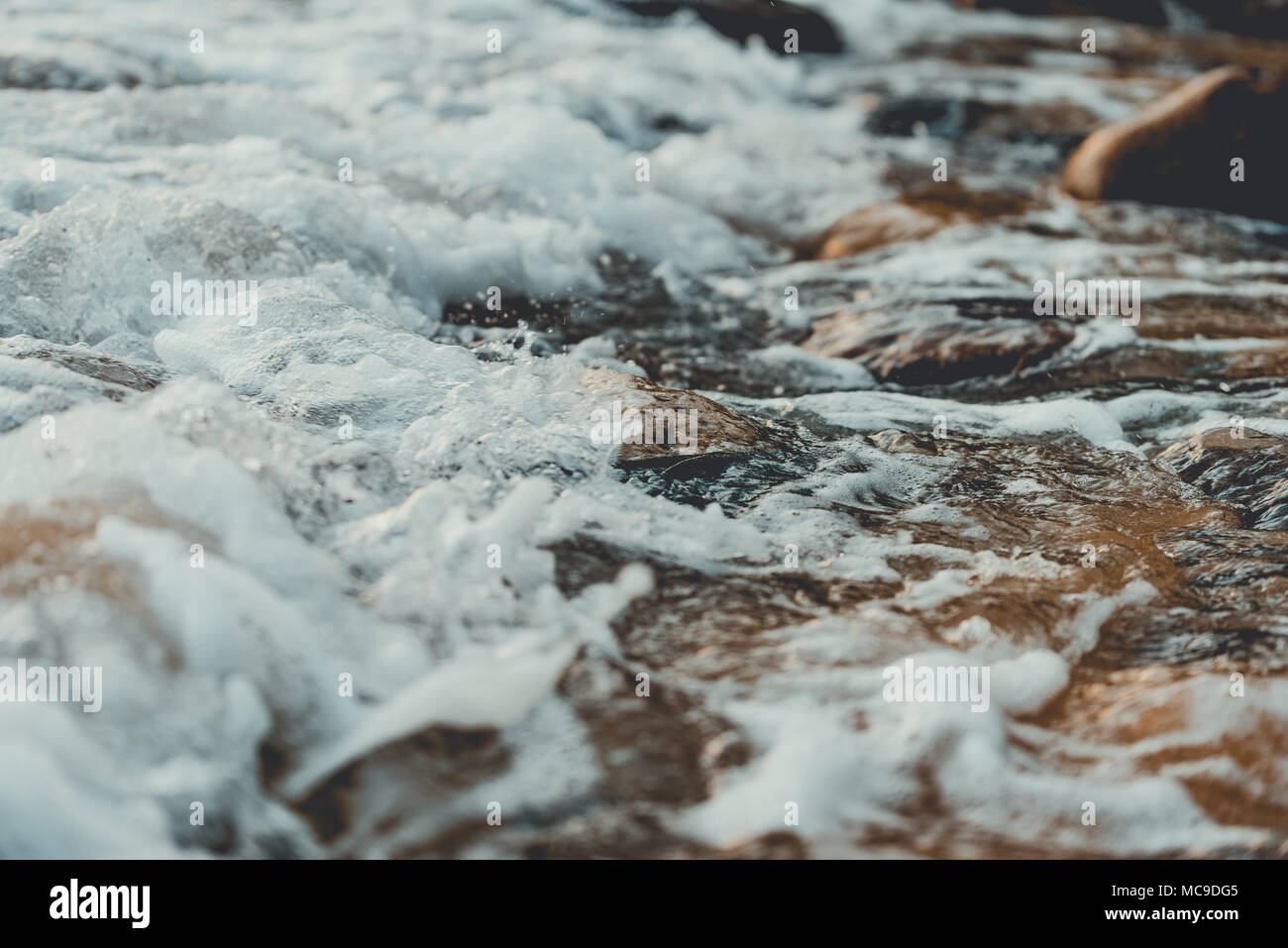 Beautiful rocky shore of the beach with waves crashing. Lazy beach, Koh ...