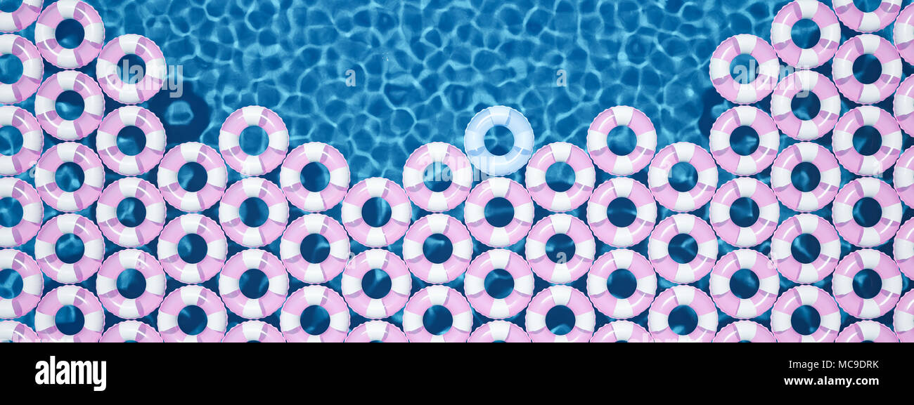 unique blue float ring between pink float rings in pool. 3d rendering ...