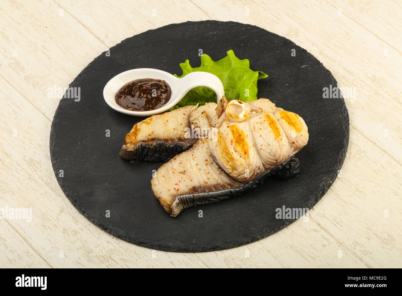 Grilled shark steak with pepper sauce and salad leaves Stock Photo - Alamy