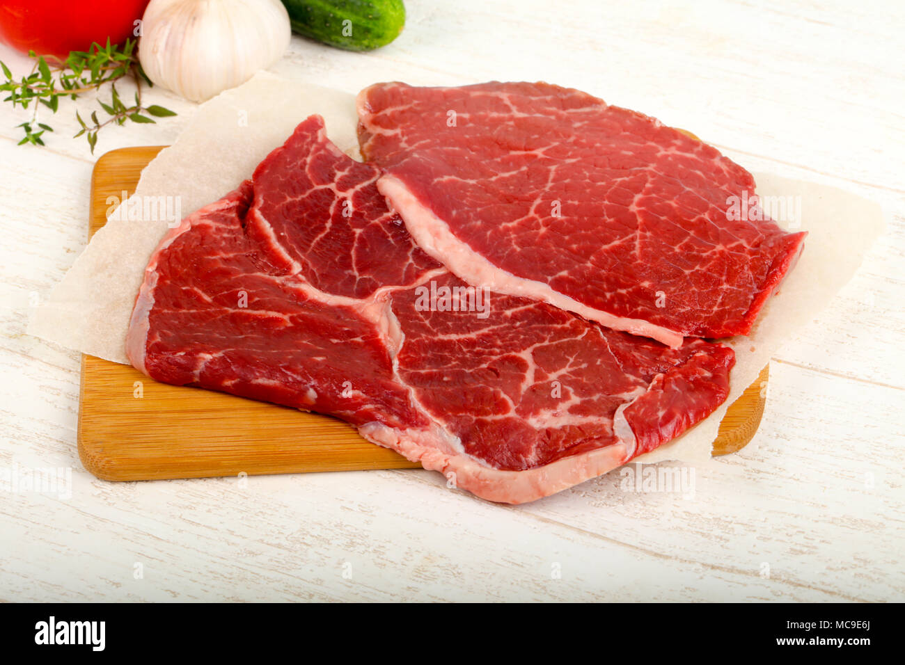 Raw beef steak ready for cooking Stock Photo - Alamy