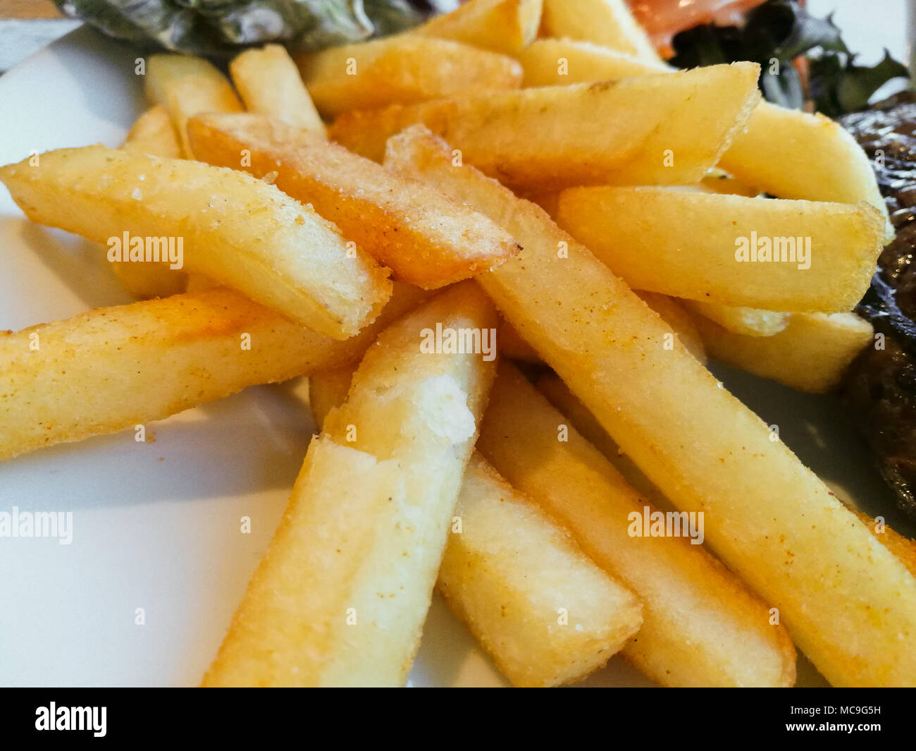 Golden fried chips served in big chunk Stock Photo - Alamy