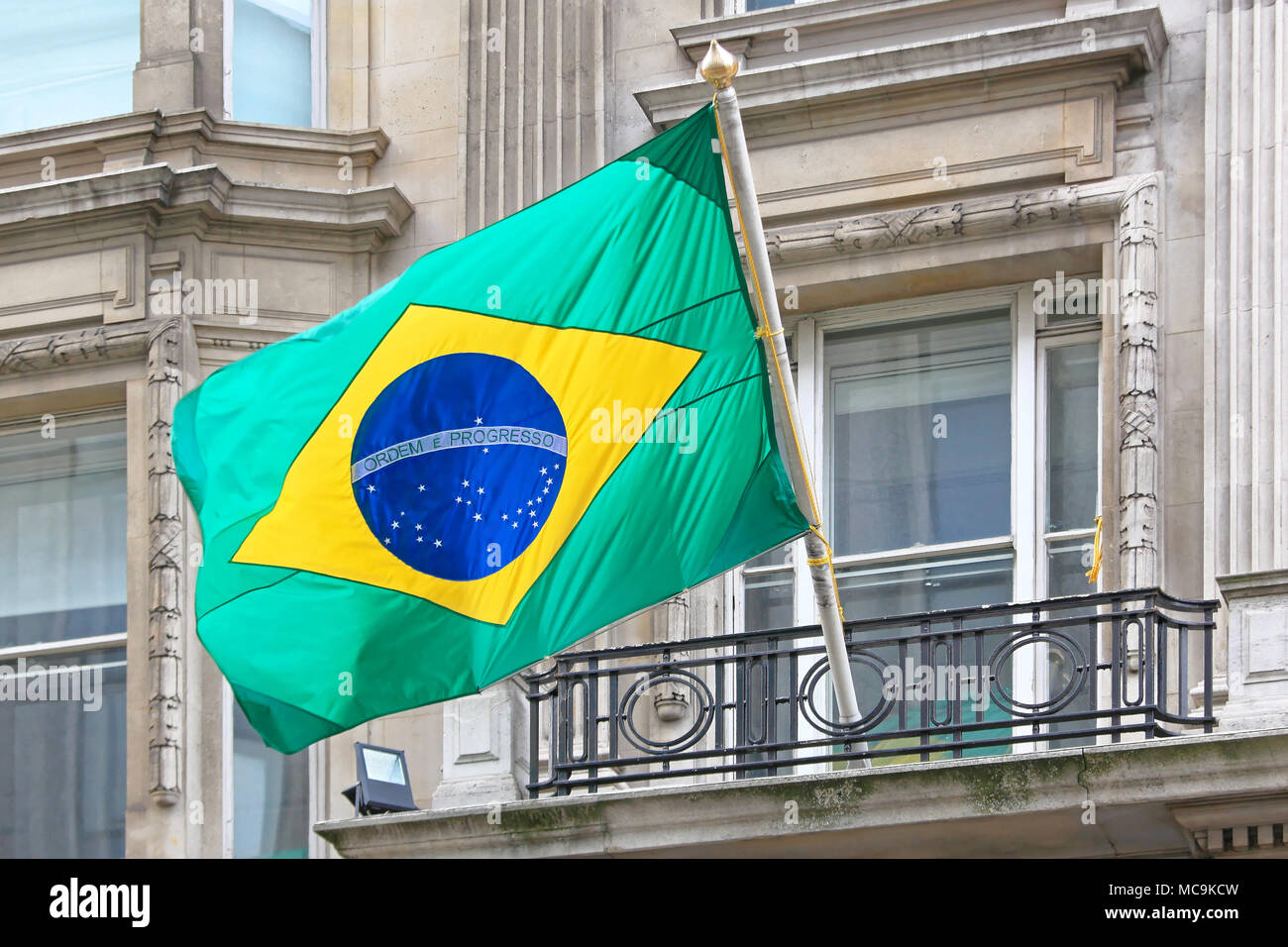 National Brazil Flag at Building Window Stock Photo - Alamy