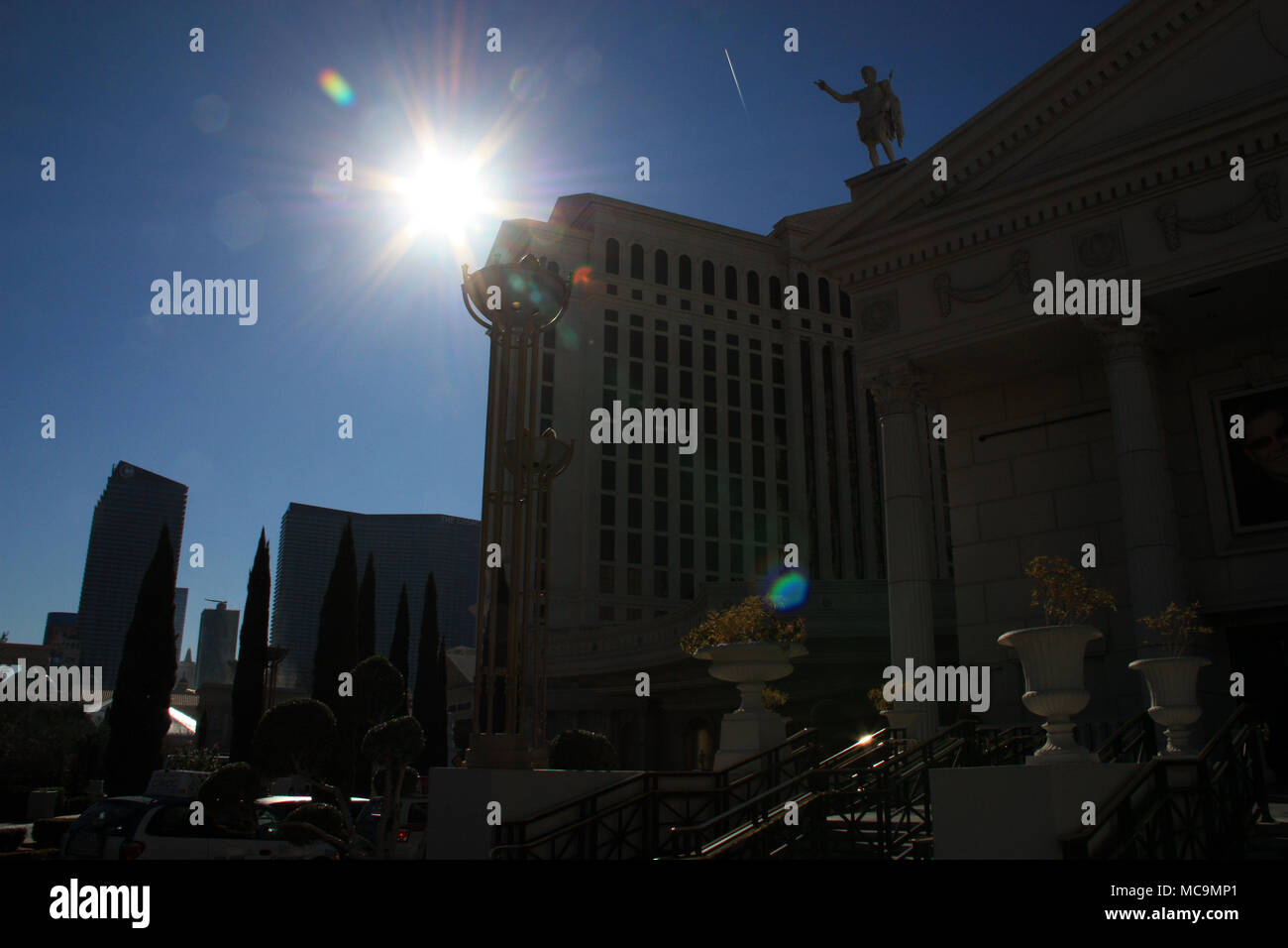 Backlit scene showing silhouettes of the Caesars Palace Hotel and ...