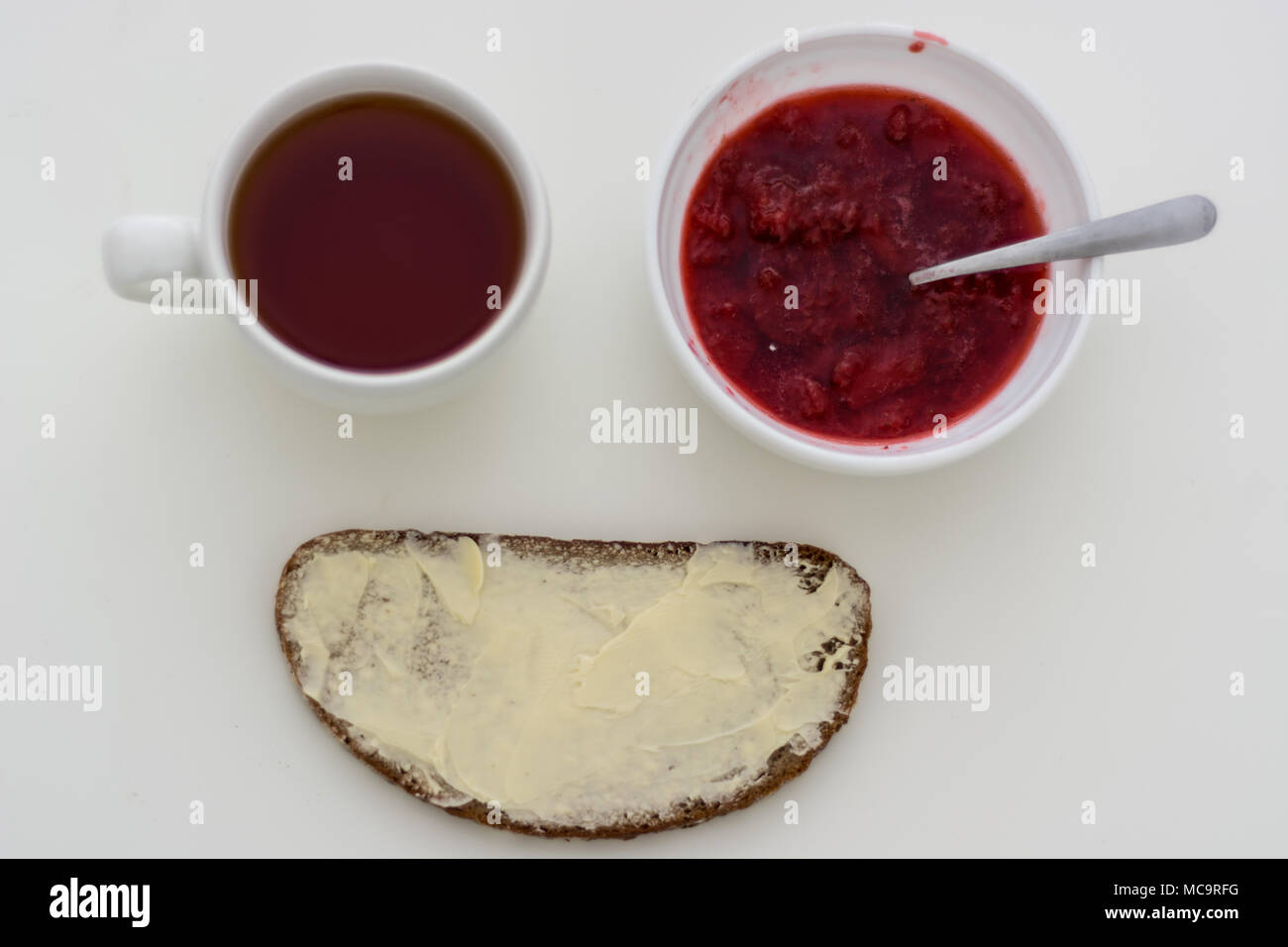 Breakfast smile black tea and strawberry jam Stock Photo - Alamy