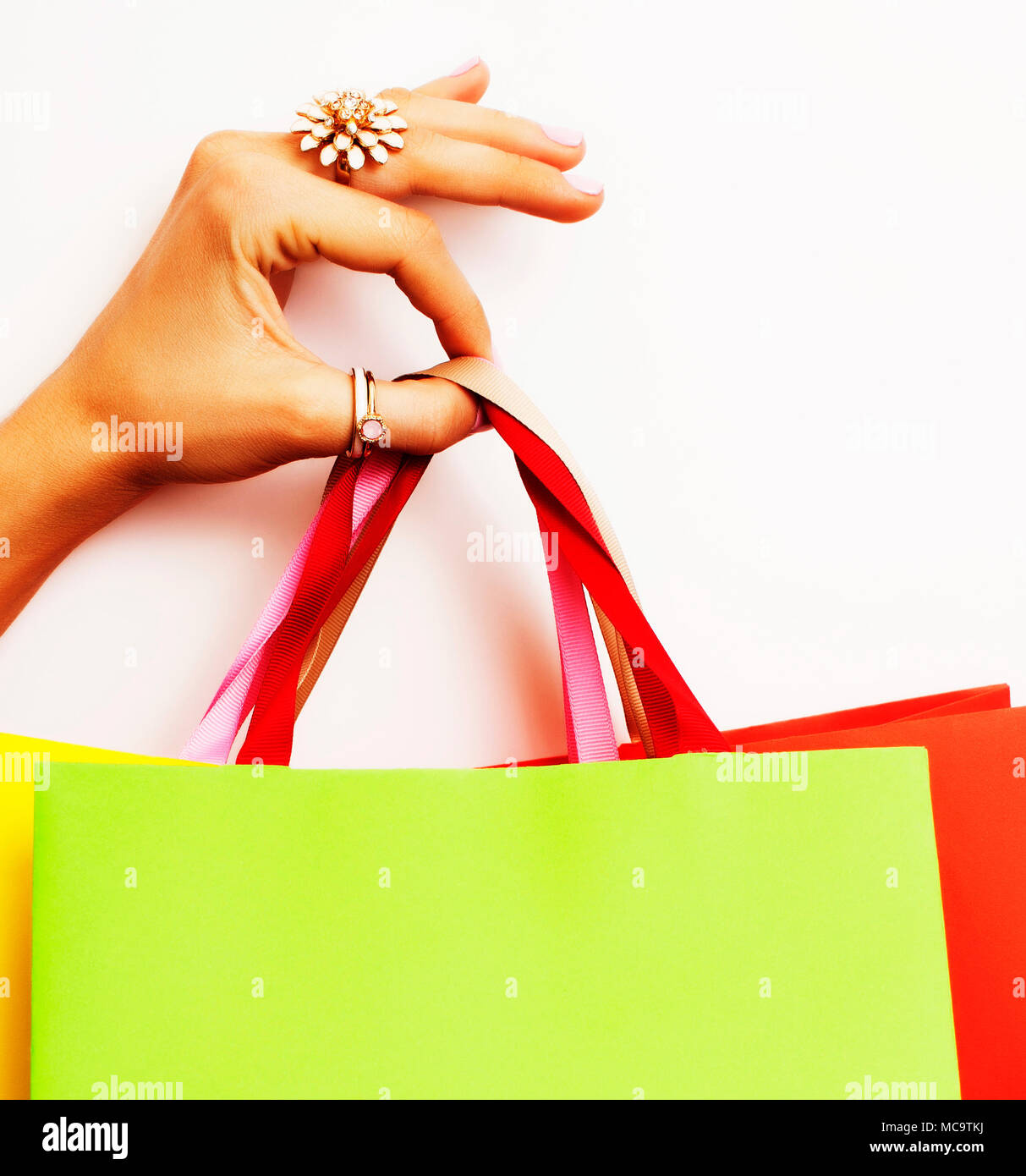 woman hand holding few paper bags on white background isolated ...