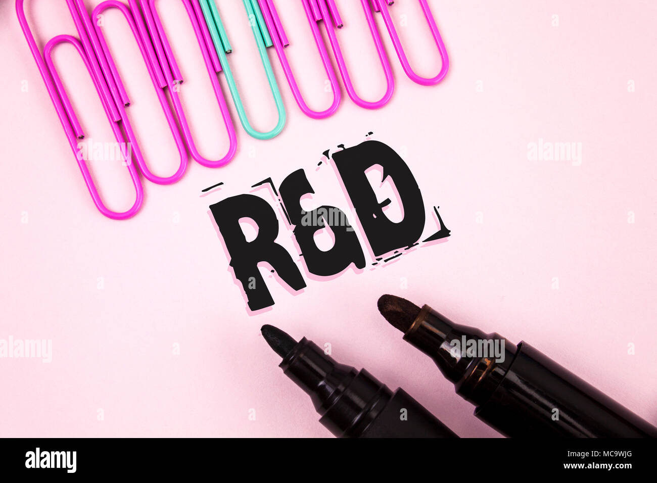 Handwriting text R D. Concept meaning Research and Development ...