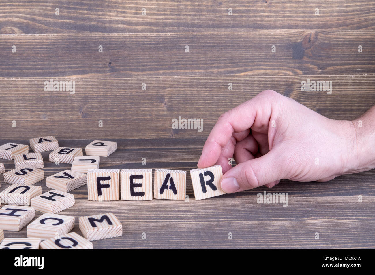 Fear. Wooden letters on the office desk Stock Photo - Alamy