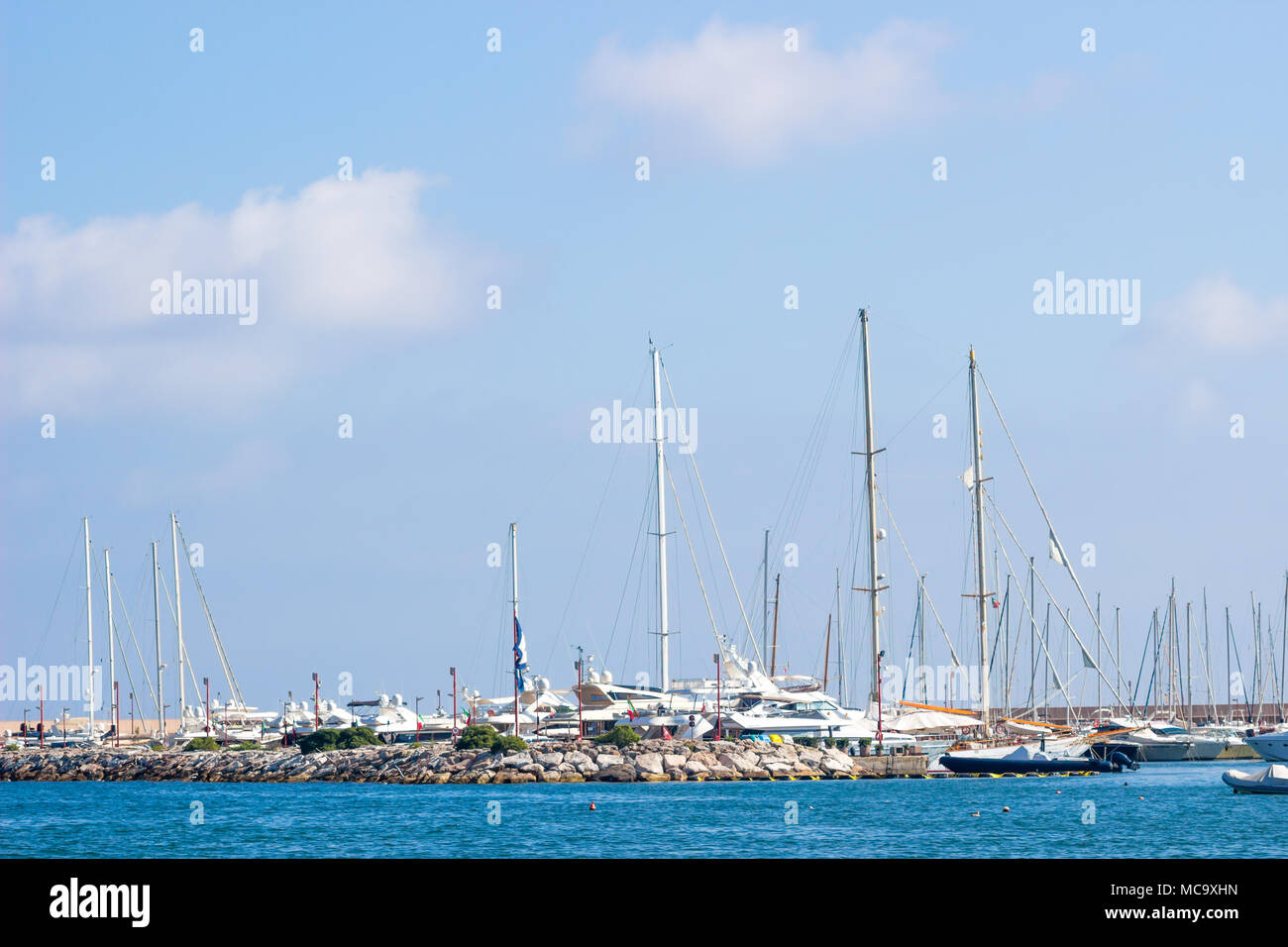 Picture of row of luxury sailboats reflected in water, yacht port on ...
