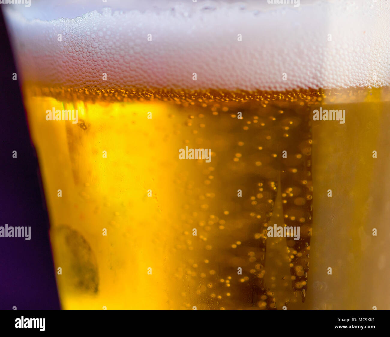 Close up Blurred image of Glass of beer background Stock Photo - Alamy