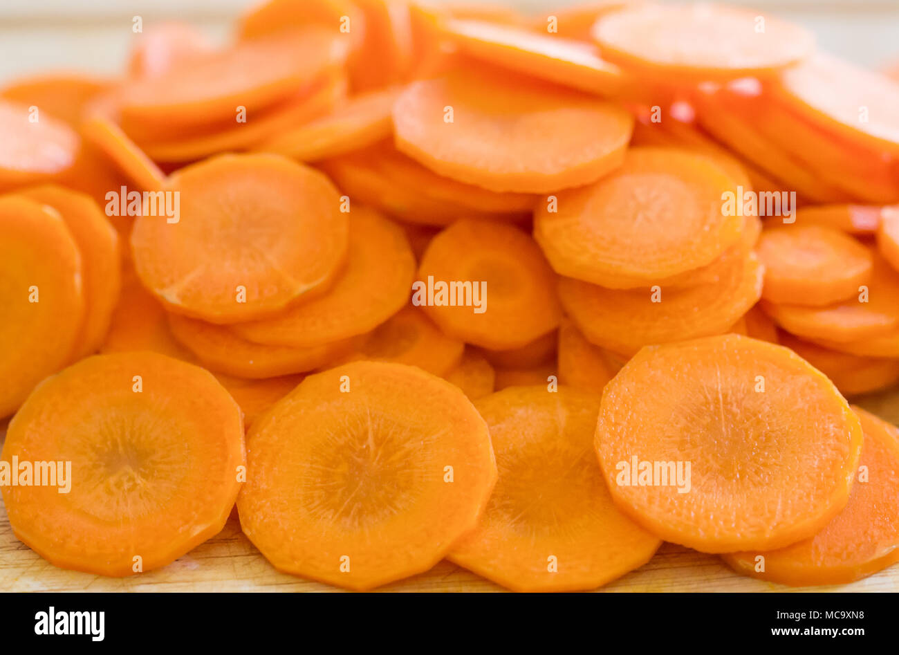 Fresh carrot, cut slices background, Carrot peeled Stock Photo - Alamy