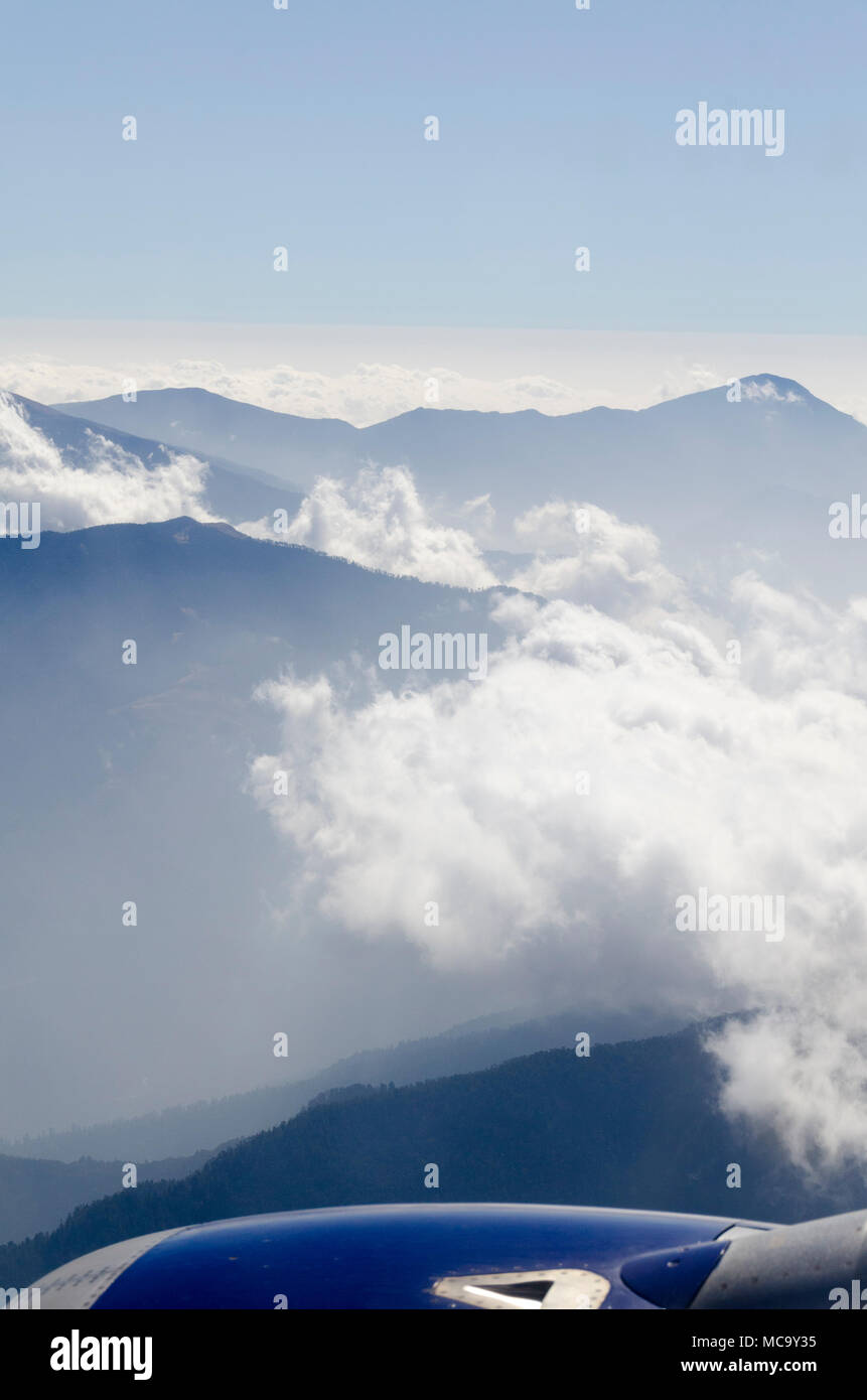 Misty hills on approach to Paro Airport, Bhutan Stock Photo - Alamy