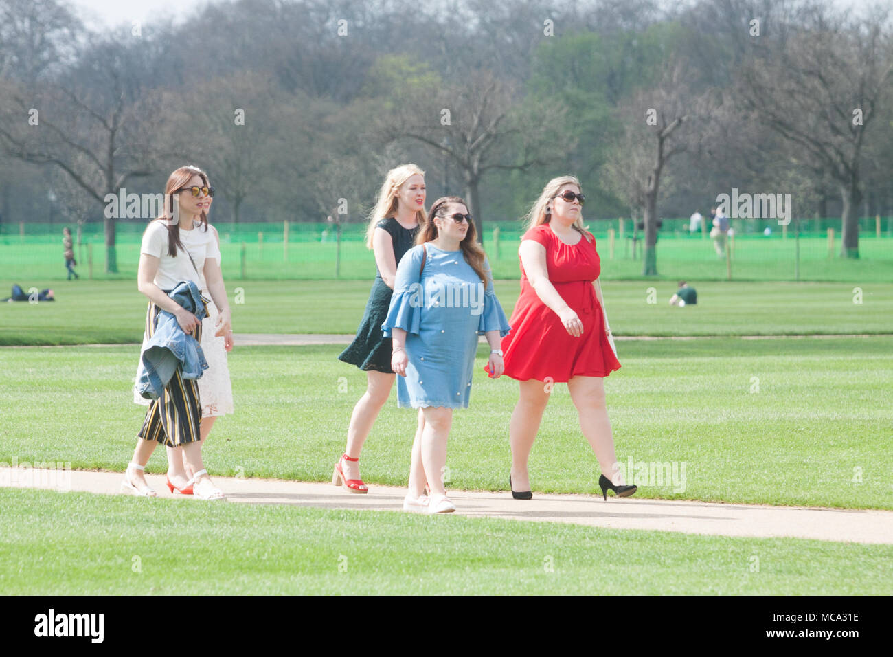 London, UK. 14 April 2018 People enjoy the spring sunshine in Hyde Park ...