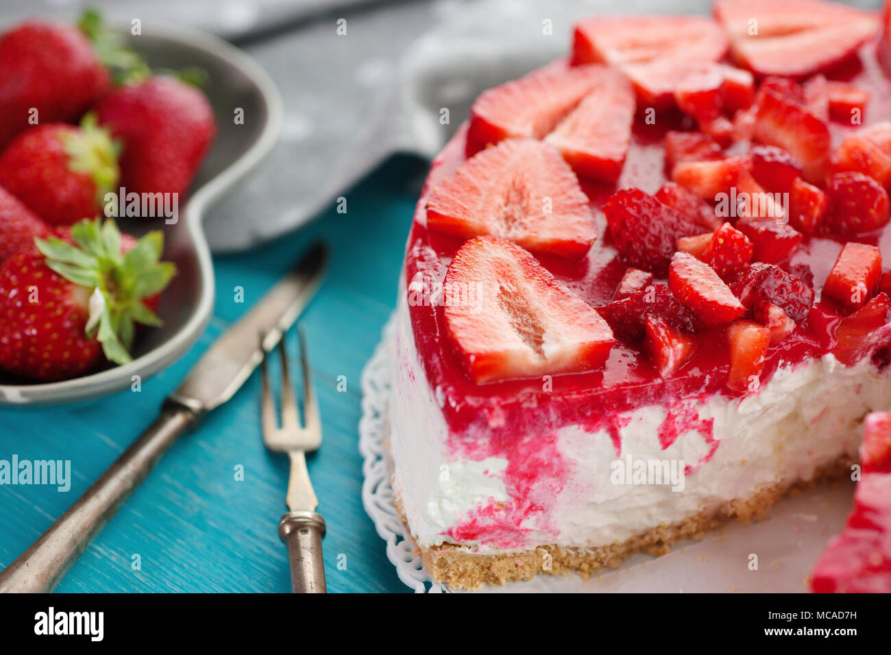 Dessert red fruit strawberry cake with fork and knife Stock Photo - Alamy
