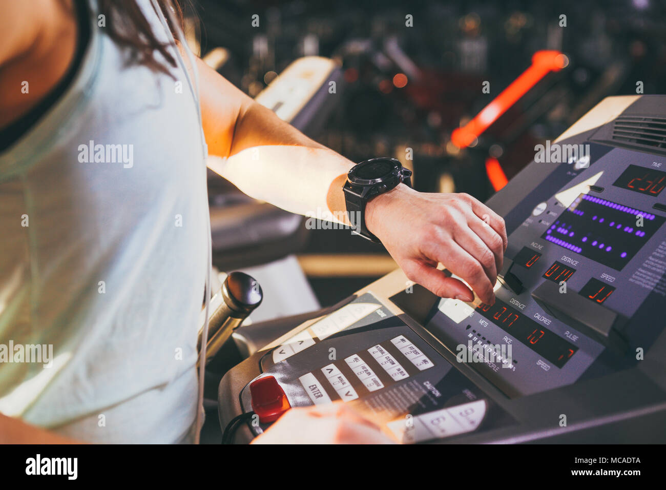 Woman uses smartwatch standing in hi-res stock photography and images ...