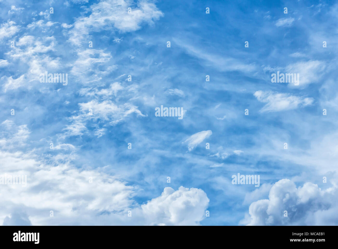 Bright blue cloudy sky. Nice fluffy clouds and great light creates this ...