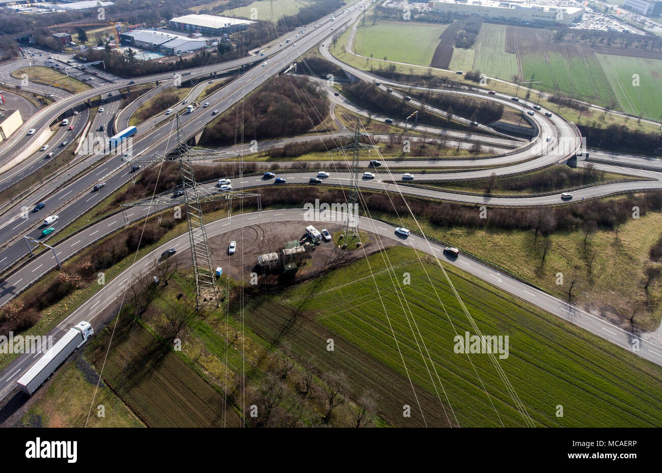 Aerial view of a highway intersection with a clover-leaf interchange in ...